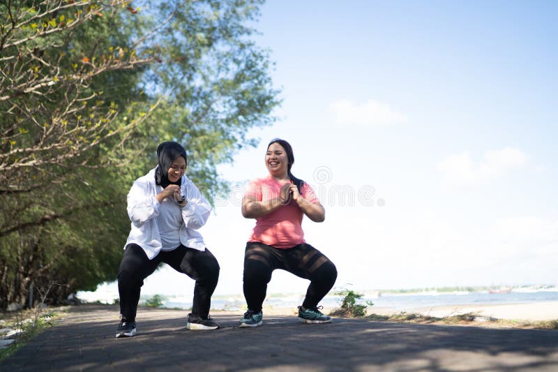 Asian Sporty Women Warming Up Squat Pose Together Stock Image - Image ... Asian Sporty Women Warming Up Squat Pose Together Stock Image - Image ...