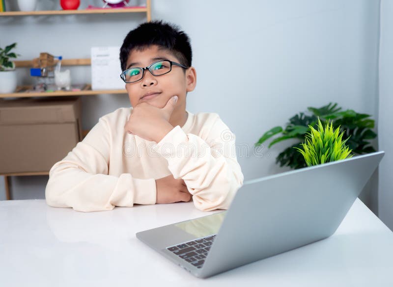 Asian Student Boy Thinking Using Computer Learning. Educational of Tech ...