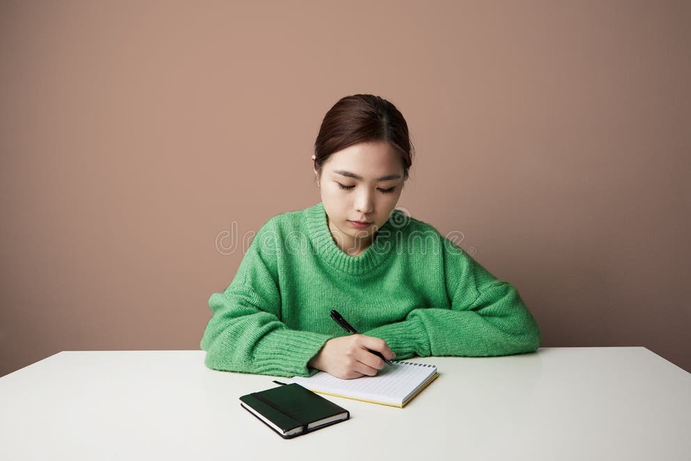 Asian Student Girl Doing Homework, Writing Notes. Isolated. Stock Photo ...