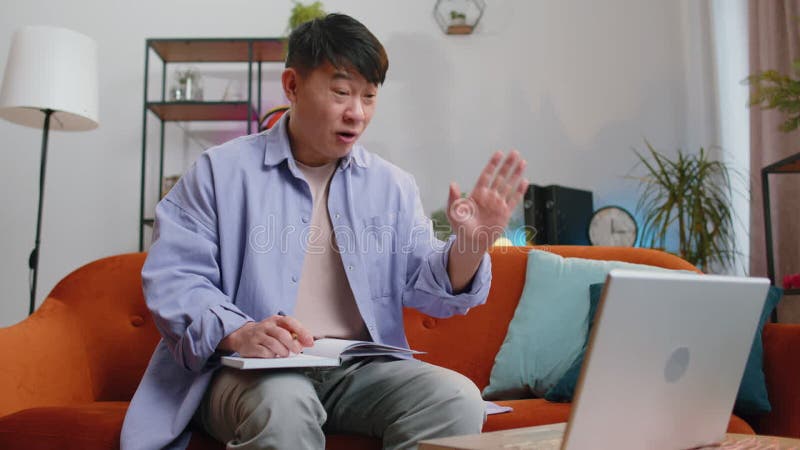 Asian Student Man at Home Making Conference Video Call Talking To ...