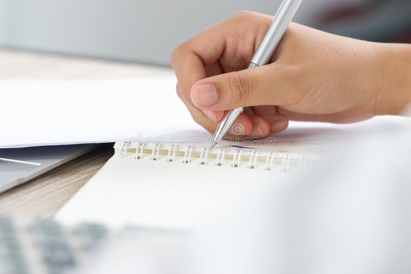 Asian Student Note on Notebook while Learning Online Study or E ...