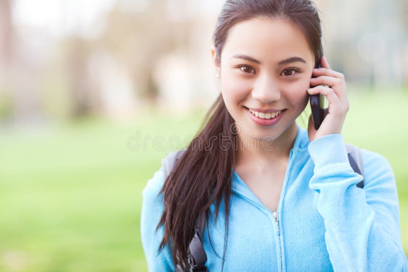 Asian student on the phone stock photo. Image of cute - 19120596