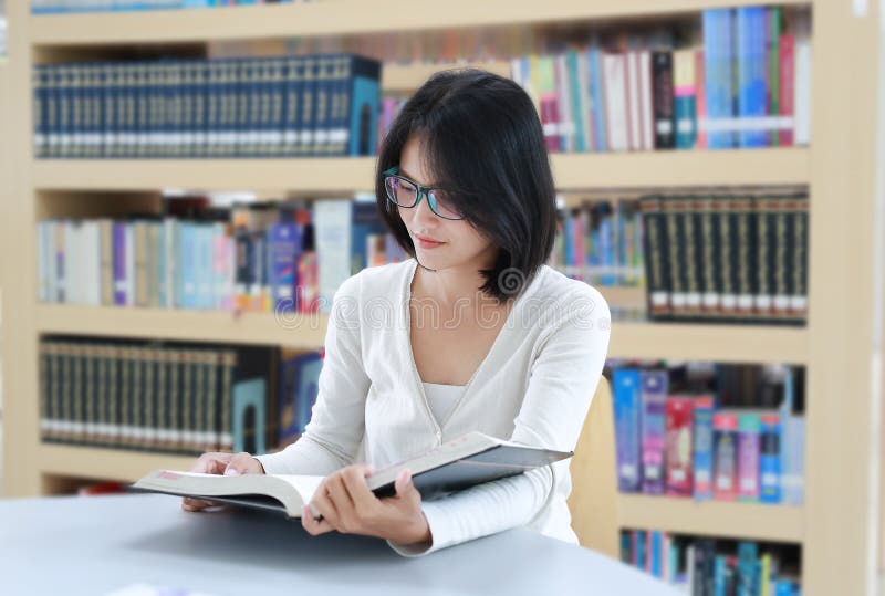 Asian Student Reading Book in the Library at University Stock Image ...