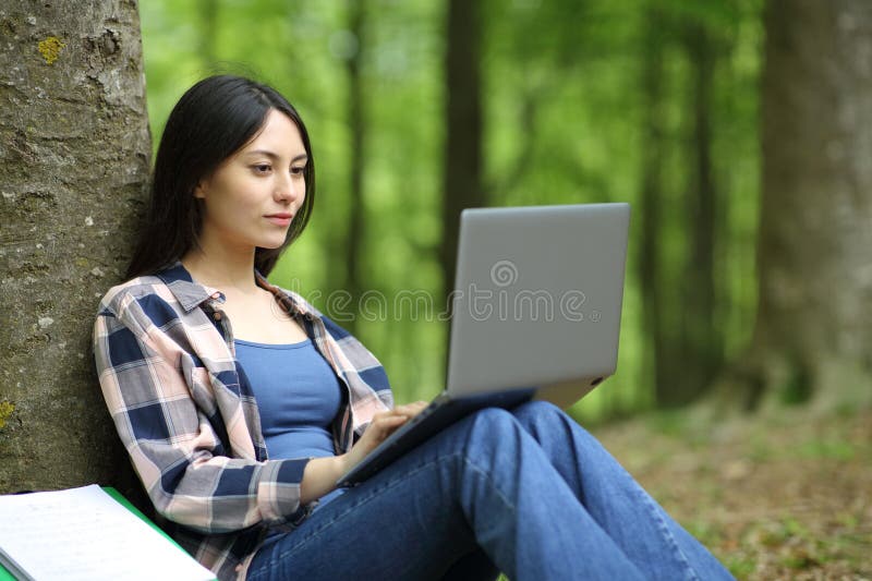 Asian Student Using Laptop in a Forest Stock Photo - Image of woman ...