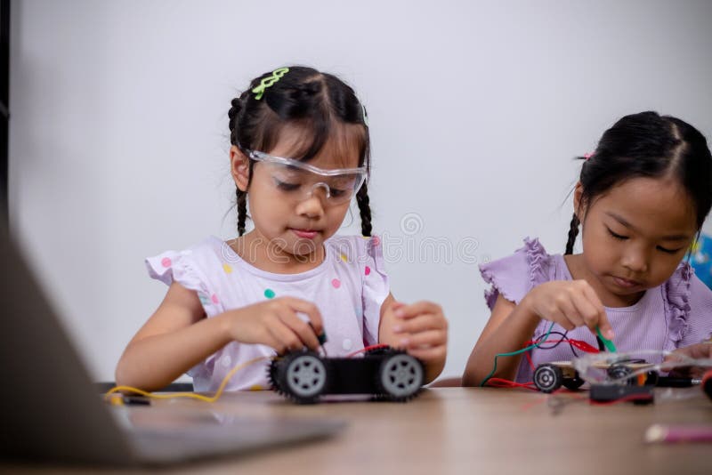 Asian Students Learn at Home by Coding Robot Cars and Electronic Board ...