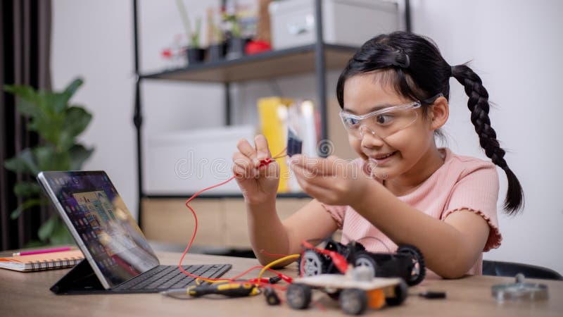 Asian Students Learn at Home by Coding Robot Cars and Electronic Board Cables in STEM, STEAM ...