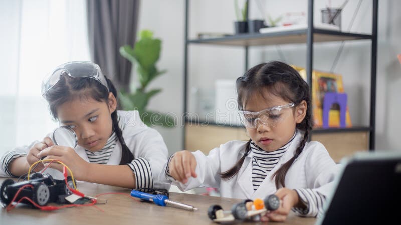Asian Students Learn at Home in Coding Robot Cars and Electronic Board ...
