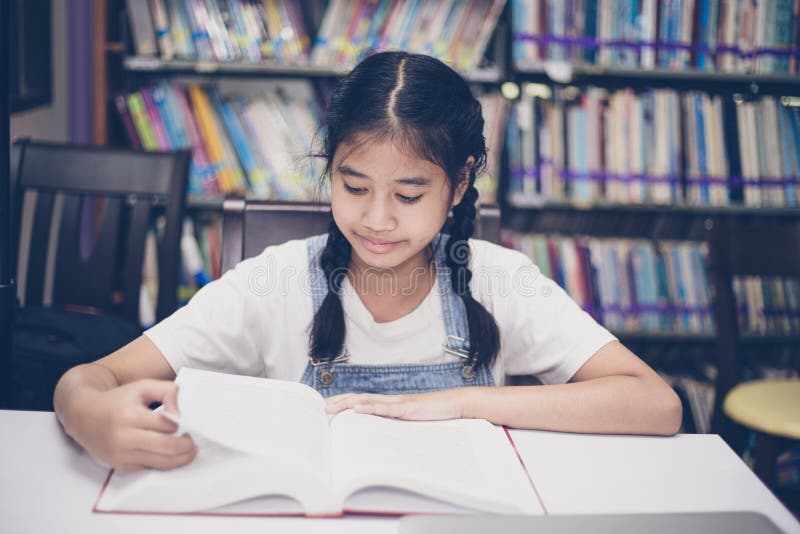 Asian Students Reading Books in the Library. Stock Photo - Image of ...