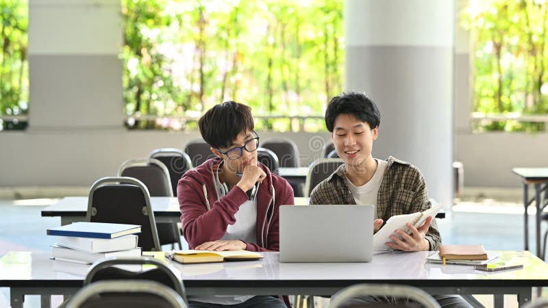 Asian Students are Using Laptop, Working Together on Academic Project ...