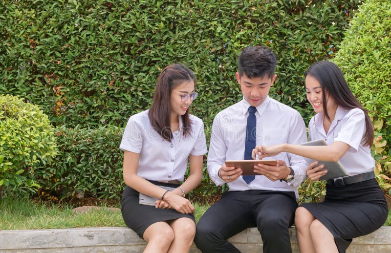 Asian Students Using Tablet To Do Homework in University Stock Image ...