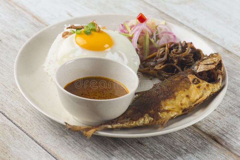 Fried Fish with Rice with Spices and Curry Stock Photo - Image of ...