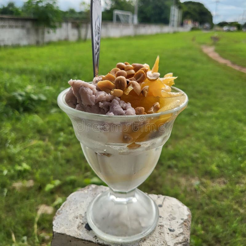 Asian Style Ice Cream with Various Fruit Toppings. Stock Image - Image ...