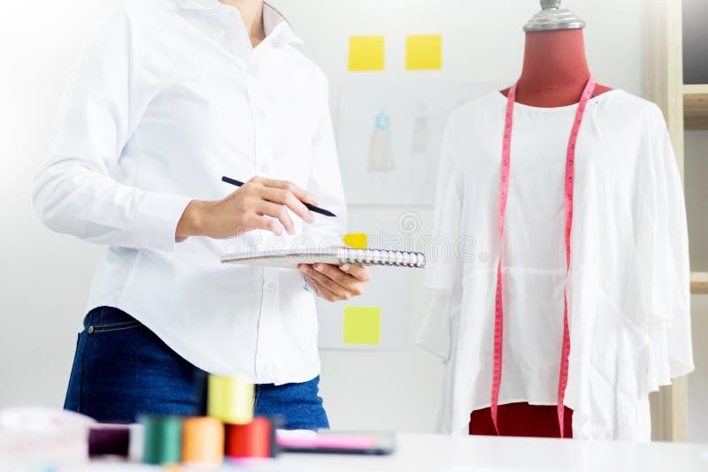 Asian Tailor Adjusts Garment Design on Mannequin in Workshop Make a ...