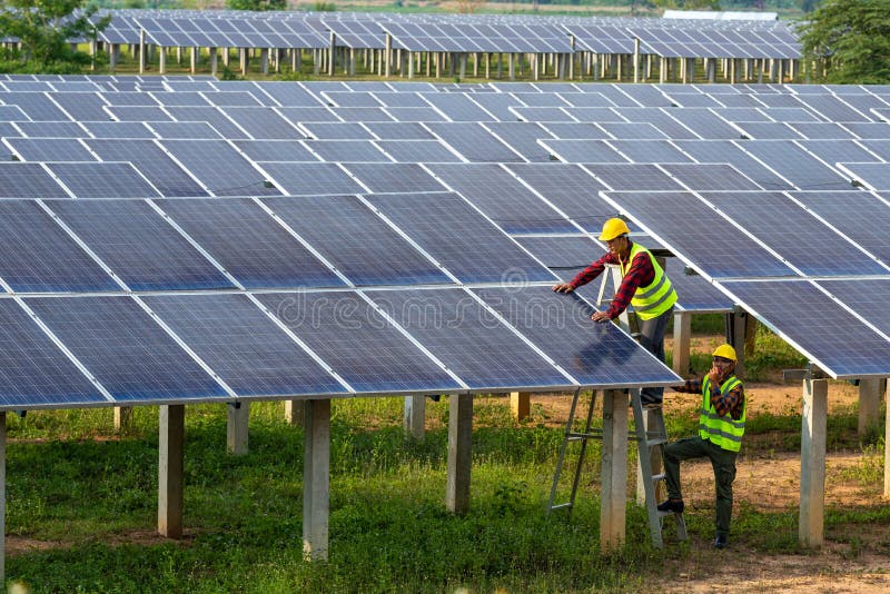 Asian Team Electrician Installing Solar Panels Working on Alternative ...