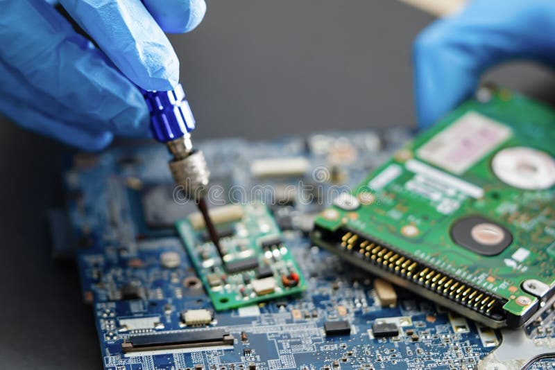 Asian Technician Repairing Micro Circuit Main Board Computer Electronic ...