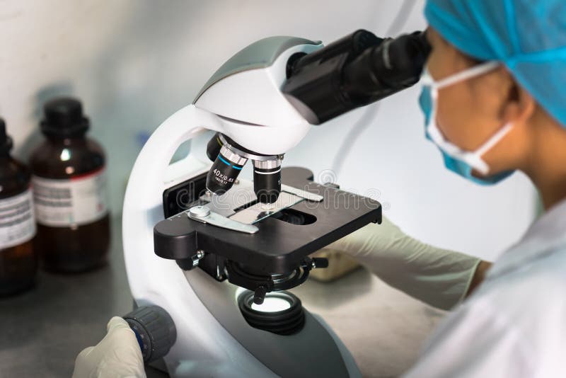 Asian Technician Tests the Quality of Product in Laboratory Closeup ...