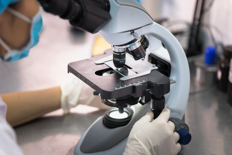 Asian Technician Tests the Quality of Product in Laboratory Closeup ...