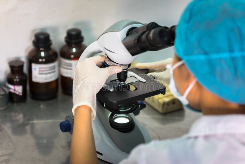 Asian Technician Tests the Quality of Product in Laboratory Closeup ... Asian Technician Tests the Quality of Product in Laboratory Closeup ...