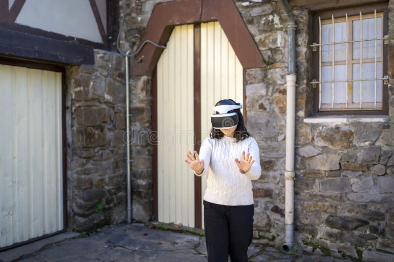 An Asian Teenager is Immersed in Virtual Reality. Stock Photo - Image ...