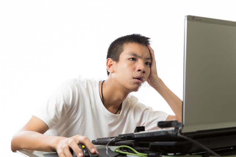 Asian Teenager Using Computer with Boring Face Stock Photo - Image of ...