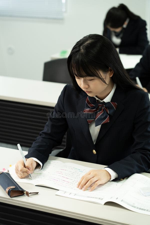 Asian Teenagers in High School Uniforms Studying in Class Stock Image ...