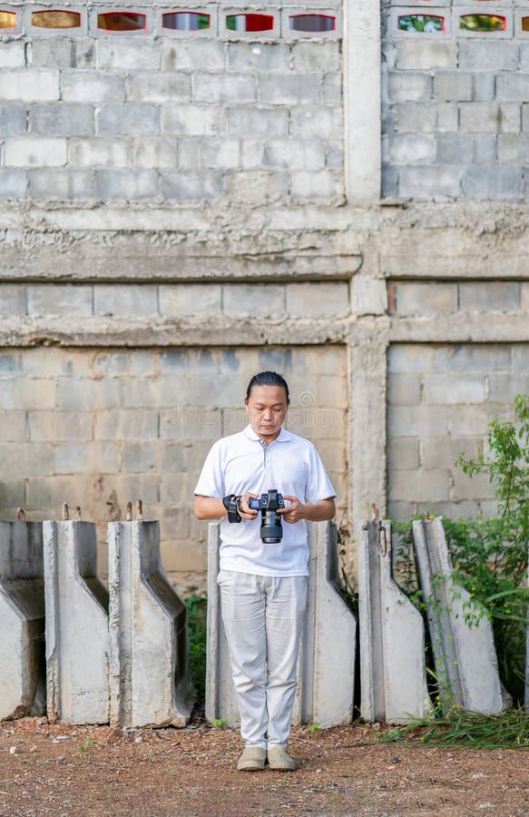Asian Thai - Chinese Professional Camera Man Posts and Check Image Shot ...
