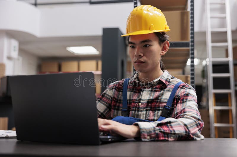 Warehouse Employee Managing Product Inventory on Laptop Stock Image ...