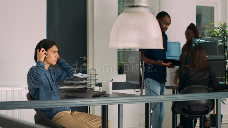 Asian Web Developer Programming Firewall Server On Terminal Window