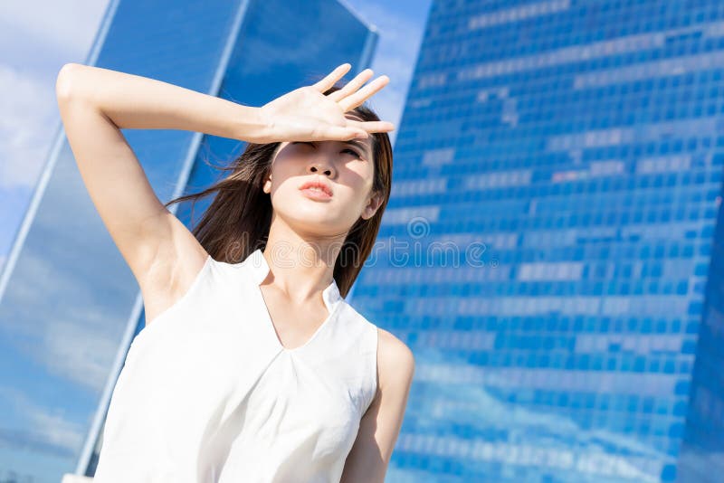Asian woman afraid of sun stock photo. Image of female - 185599254