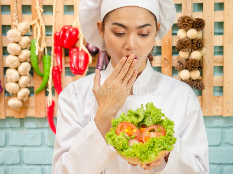 Asian Woman in Chef`s Uniform is Cooking in the Kitchen Stock Photo ...
