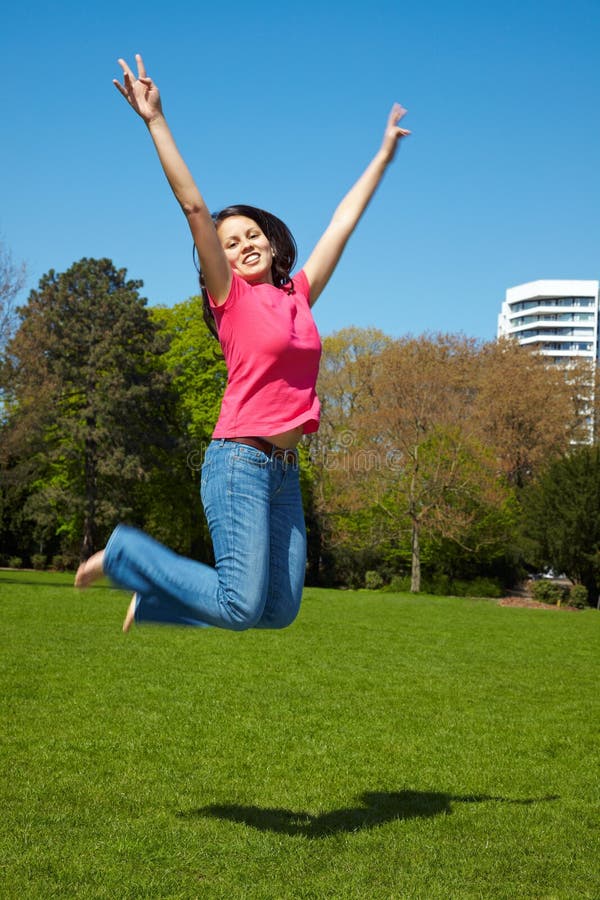 Happy asian woman jumping stock image. Image of freedom - 14837815
