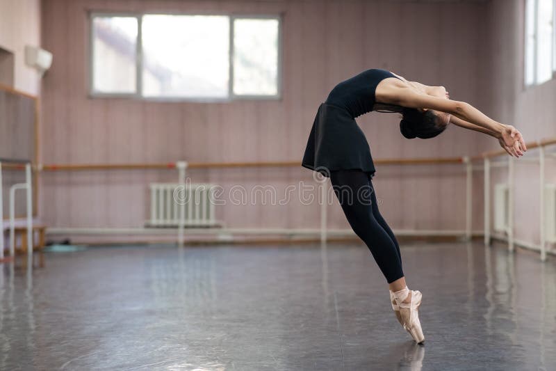 Asian Woman Dancing in Ballet Class. Bending in the Back. Stock Image ...