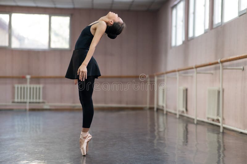 Asian Woman Dancing in Ballet Class. Bending in the Back. Stock Photo ...