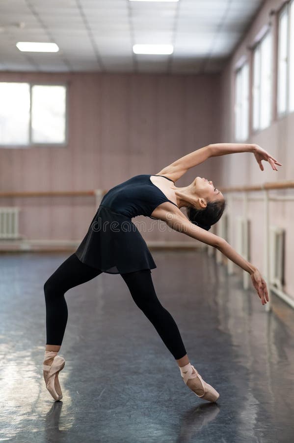 Asian Woman Dancing in Ballet Class. Bending in the Back. Stock Photo ...