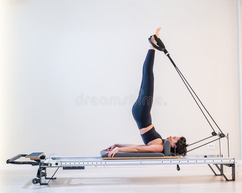 Asian Woman Doing Pilates on Reformer. Stock Photo - Image of ...