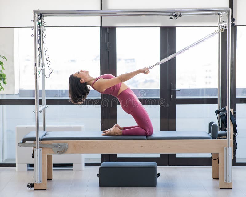 Asian Woman Doing Pilates on Reformer Machine. Stock Image - Image of ...