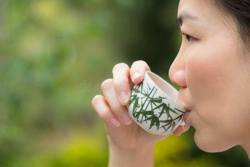 Asian woman drinking tea stock photo. Image of happy - 36813008