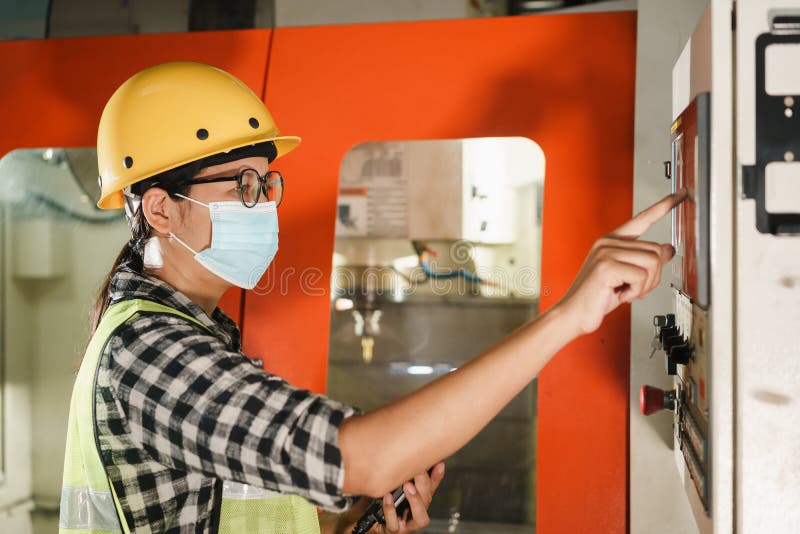 Asian Woman Engineer Working on Machine Control Panel Display and ...