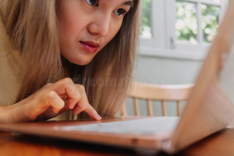 Asian Woman Focus and Concentrate Work Online in the Computer Laptop in ...