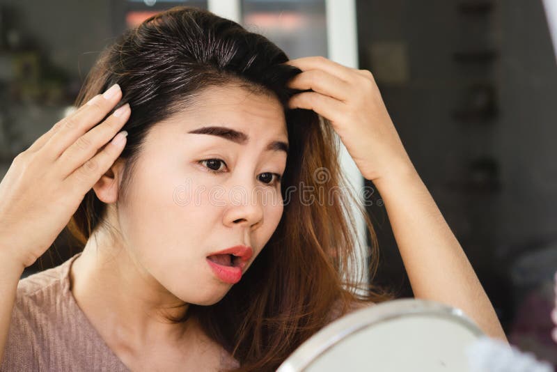 Asian Woman Having Problem with Grey Hair Looking at the Mirror Stock ...