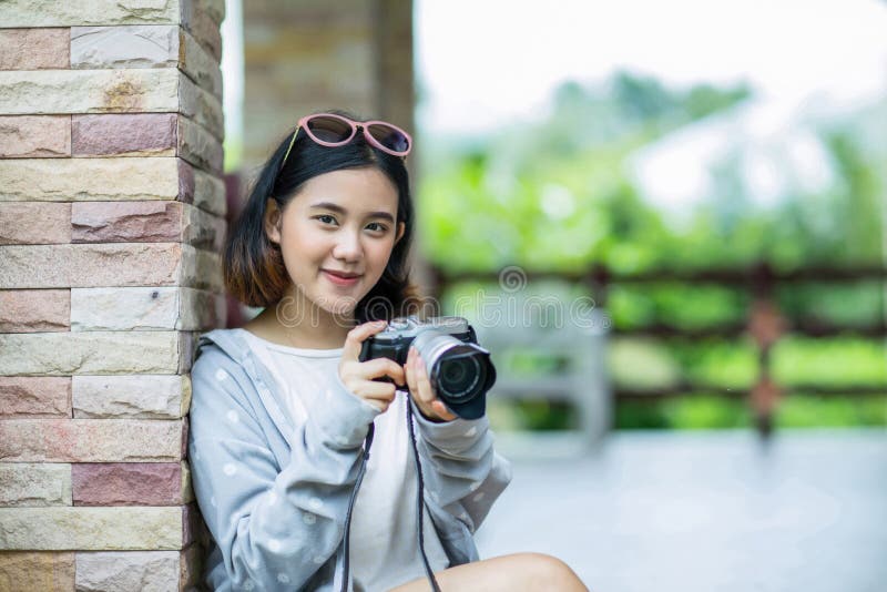 Asian Woman Holding a Camera with Happiness Stock Image - Image of ...