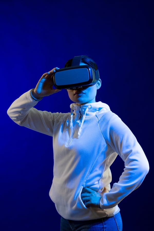 Asian Woman Holding Vr Headset in Studio with Blue Light with Copy ...