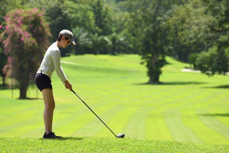 Asian Woman Playing Golf on a Beautiful Natural Golf Course Stock Image ...