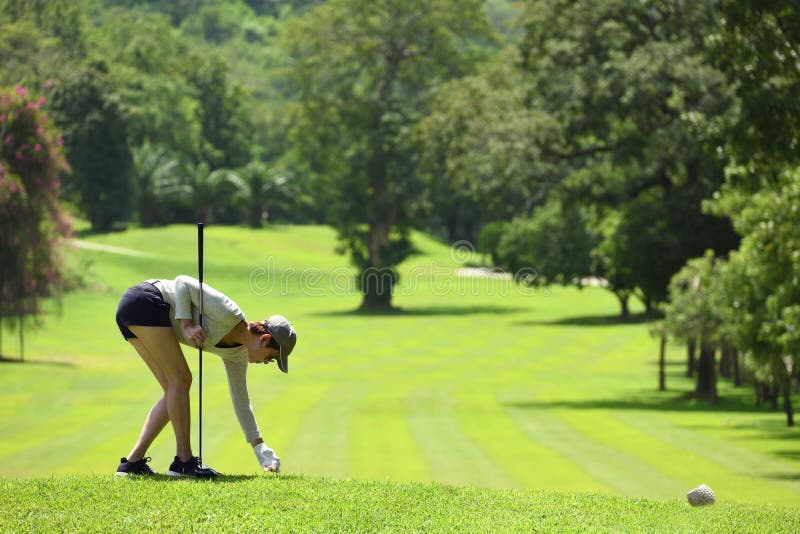 Asian Woman Playing Golf on a Beautiful Natural Golf Course Stock Photo ...