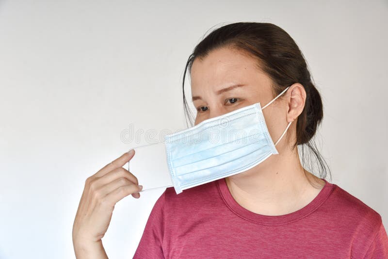Asian Woman Removing a Mask Stock Photo - Image of influenza, face ...
