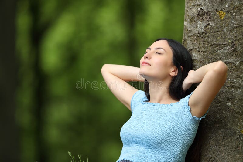 Asian Woman Resting on a Tree in a Park Stock Photo - Image of eyes ...
