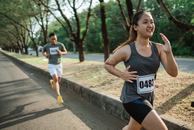 Asian Woman Running at Marathon Competition Stock Photo - Image of ...