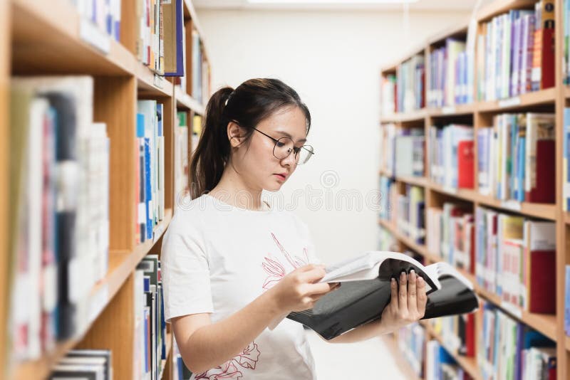 Woman Standing Corridor Library Reading Book Stock Photos - Free ...