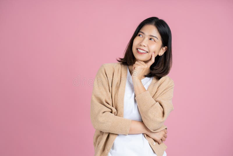 Asian Woman Thinking Something and Standing on Pink Background ...