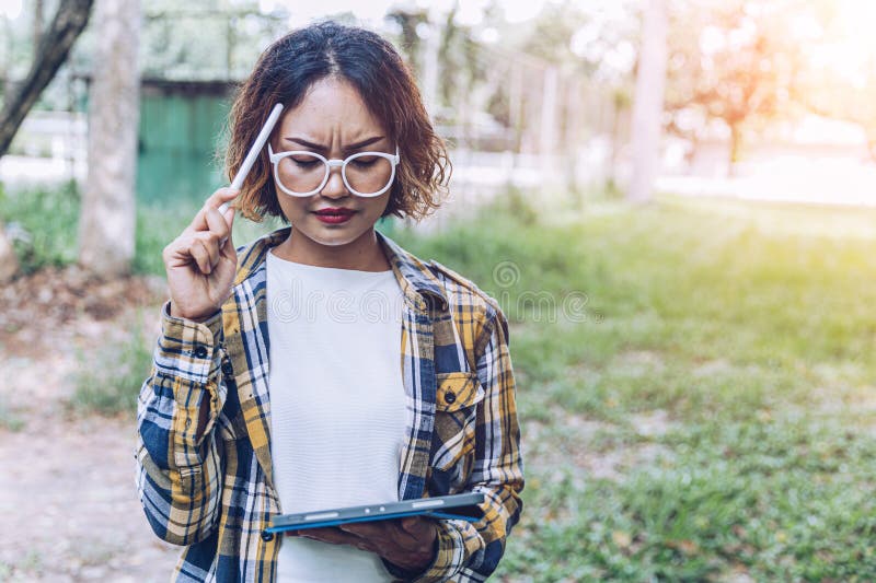 Asian Woman Using Ipad Working in Garden Stock Image - Image of women ...